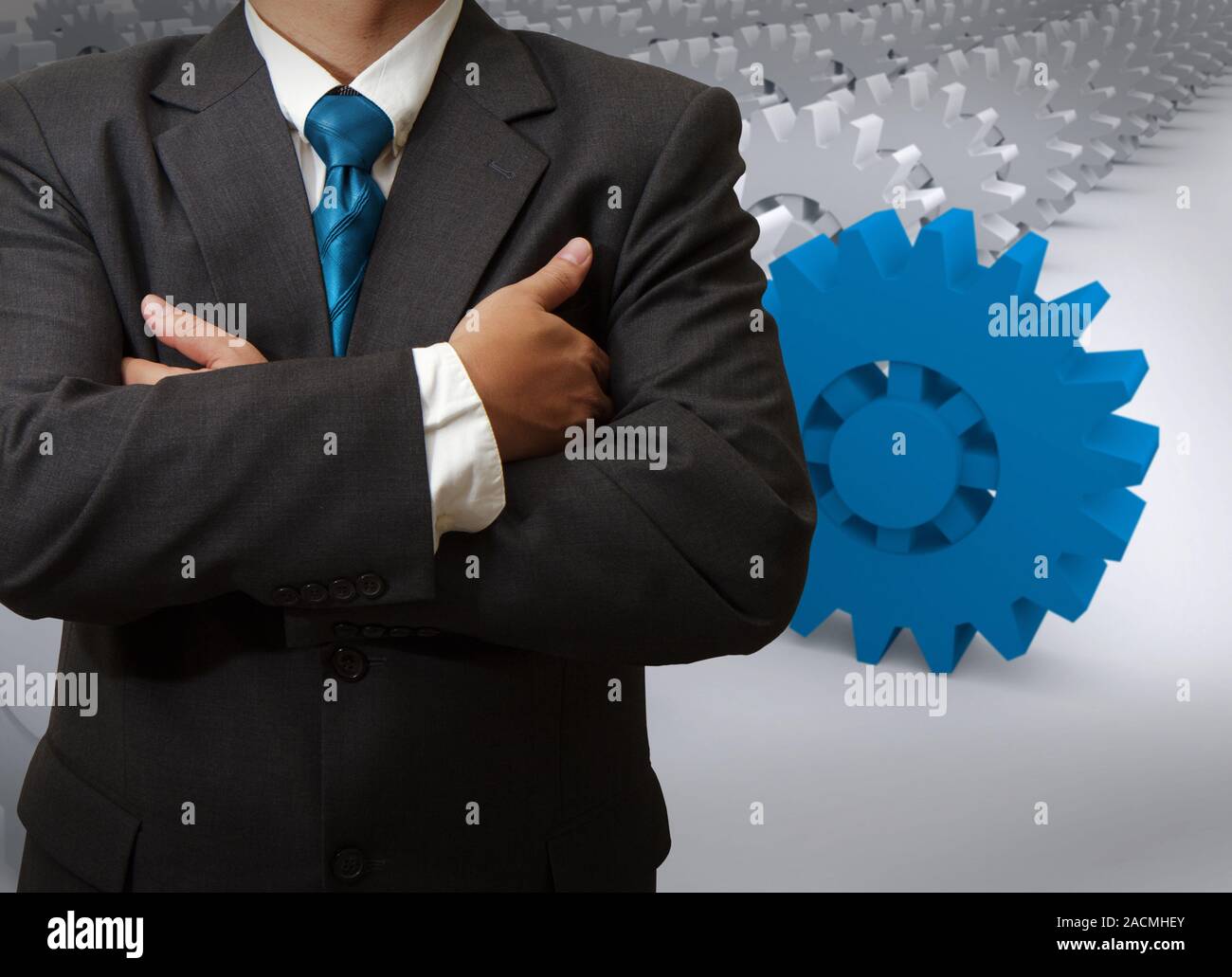 Businessman and gear to success Stock Photo - Alamy