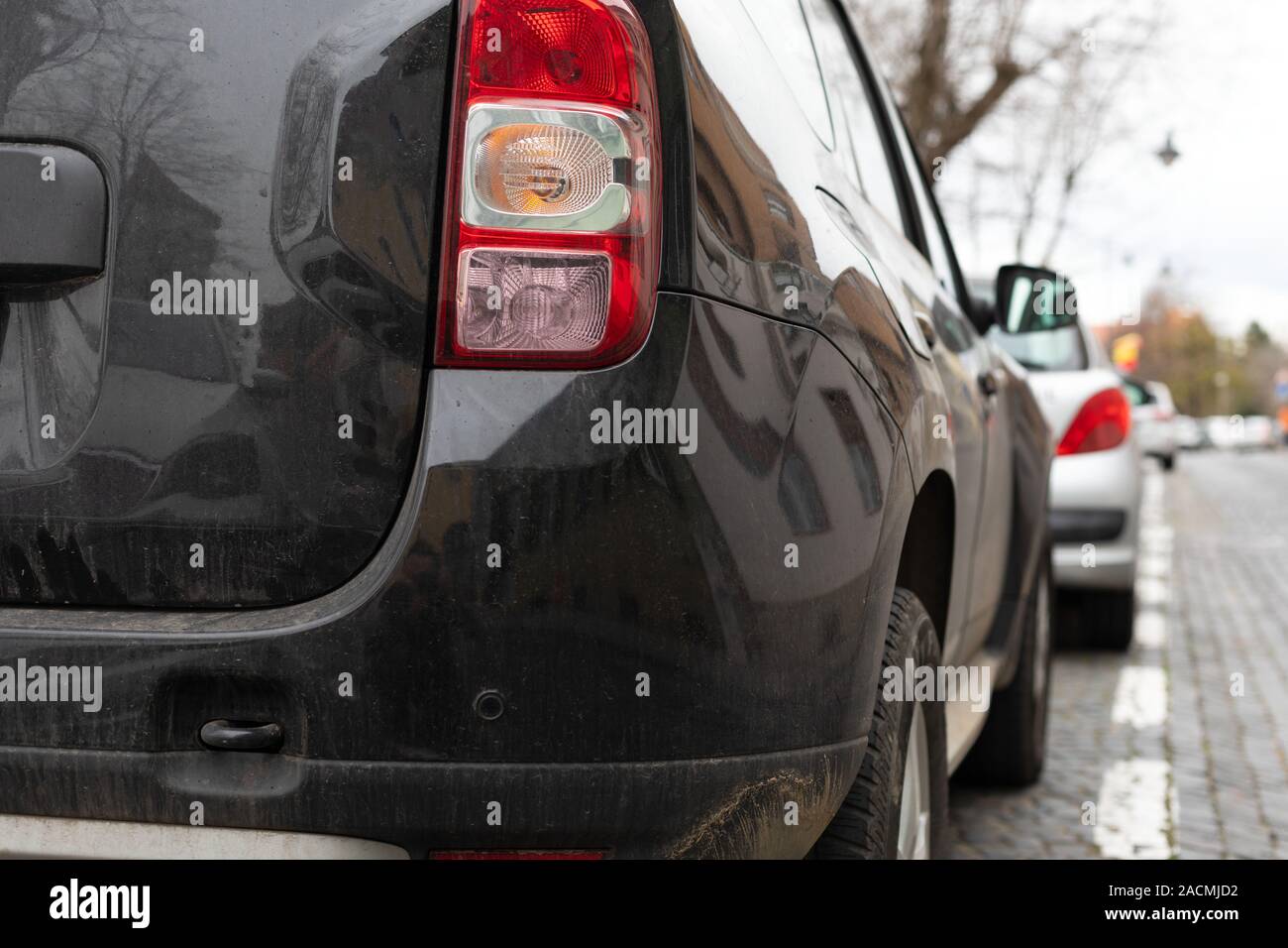 Scenic picture of a street in Sibiu medieval center, cars parked along ...