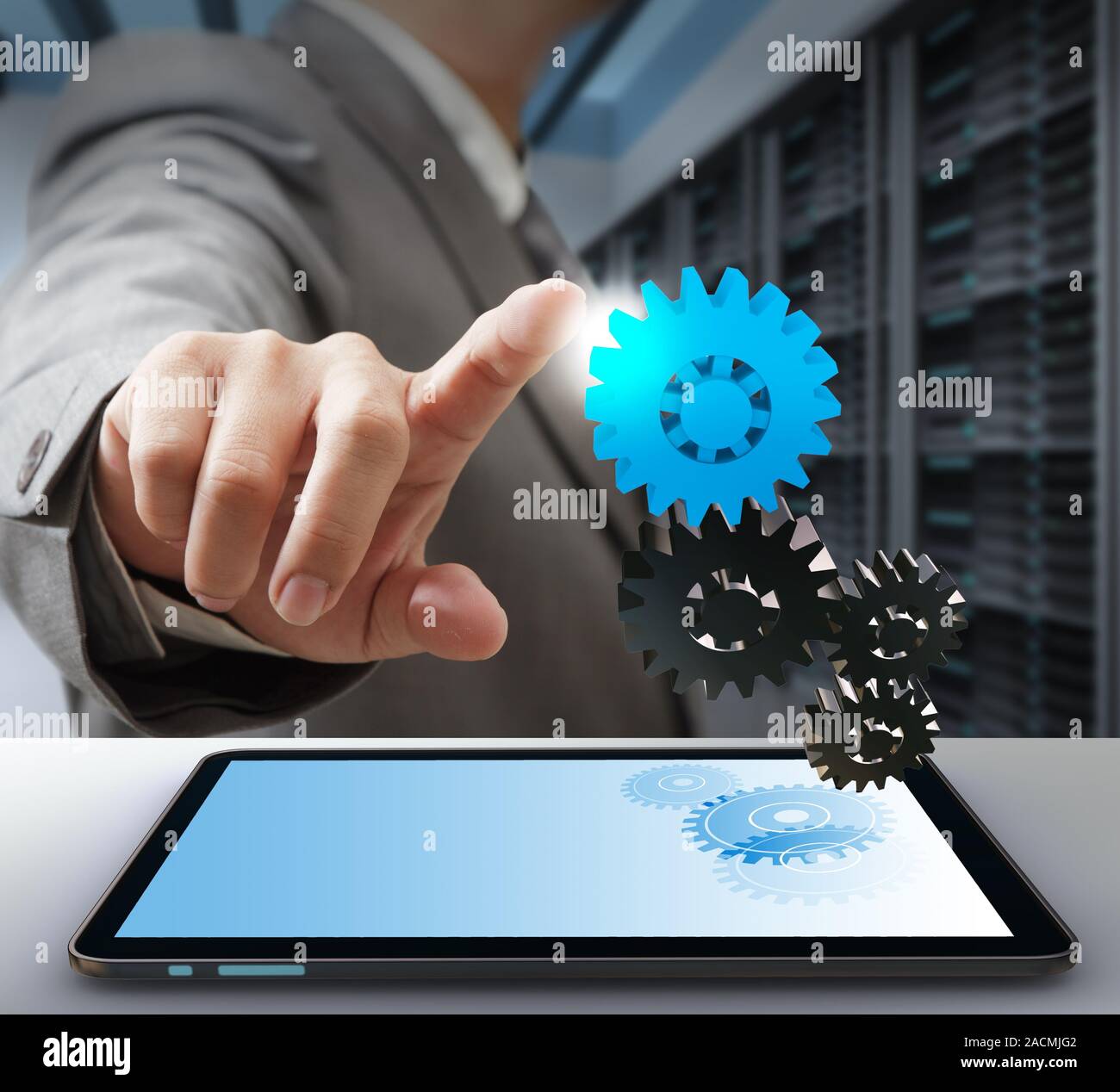Business man touch on gear as computer solution concept Stock Photo - Alamy