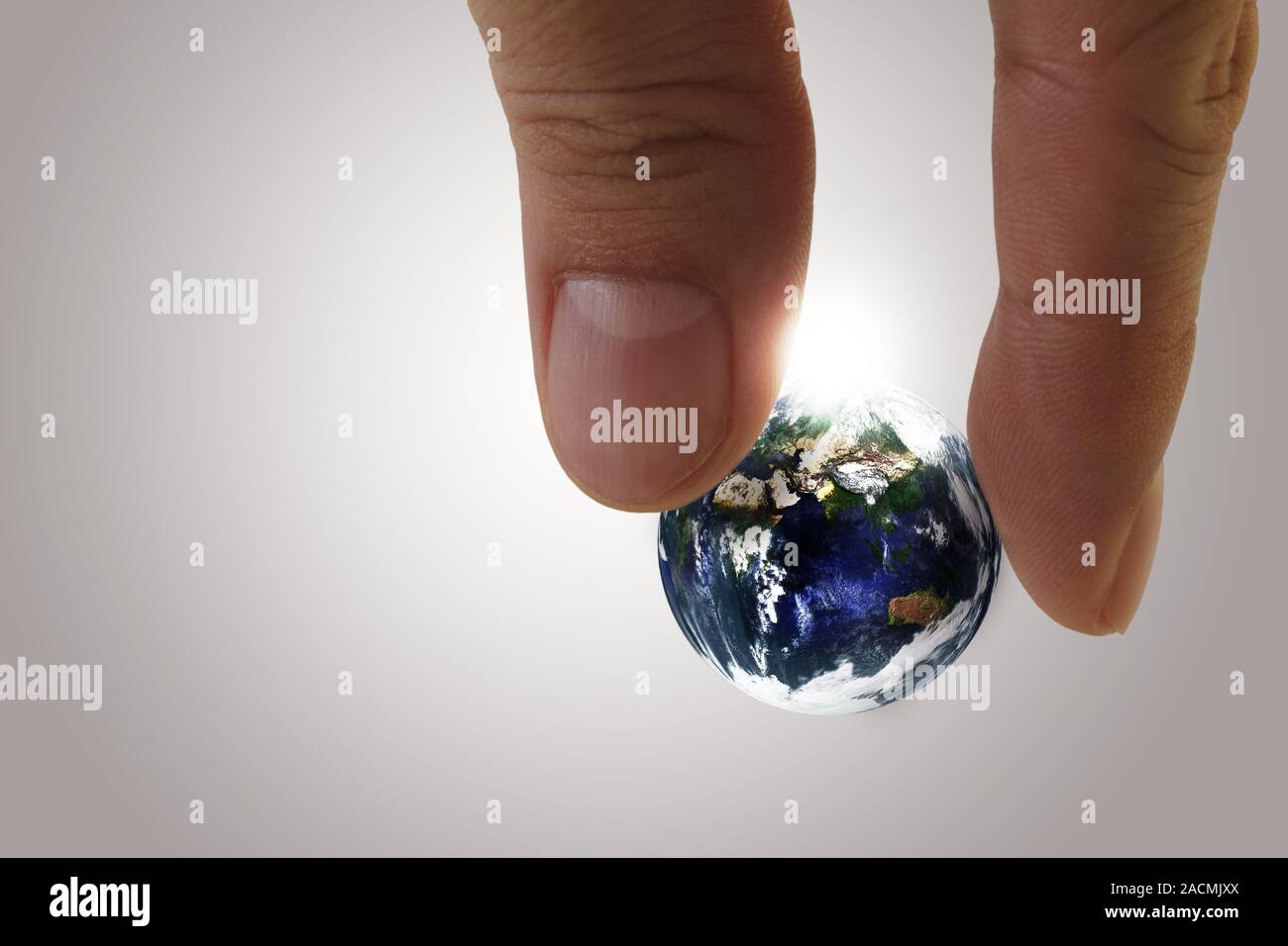 globe in fingers Stock Photo - Alamy