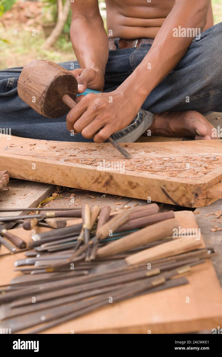 Traditional craftsman carving wood Stock Photo - Alamy