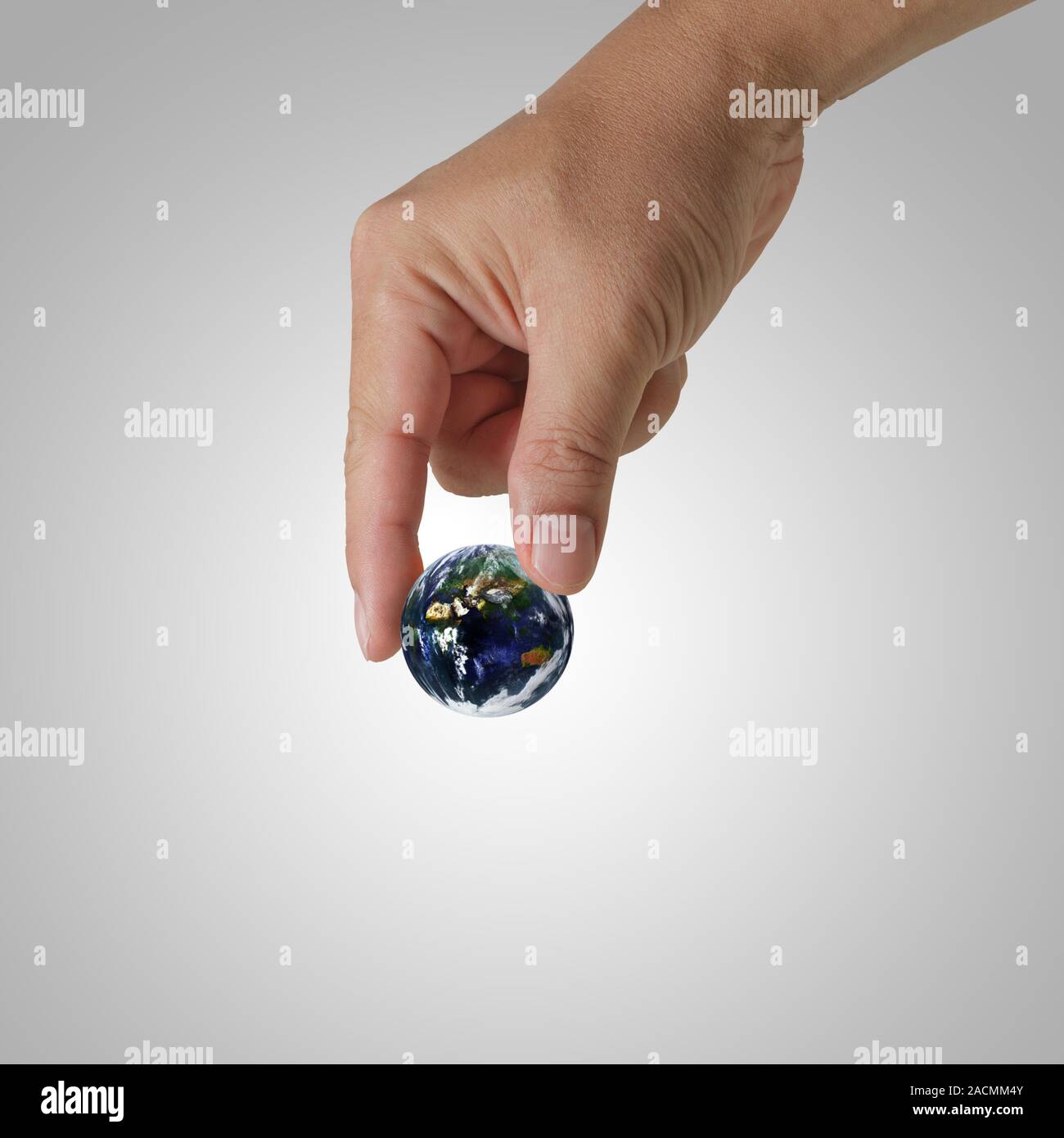hand pick the earth Stock Photo - Alamy