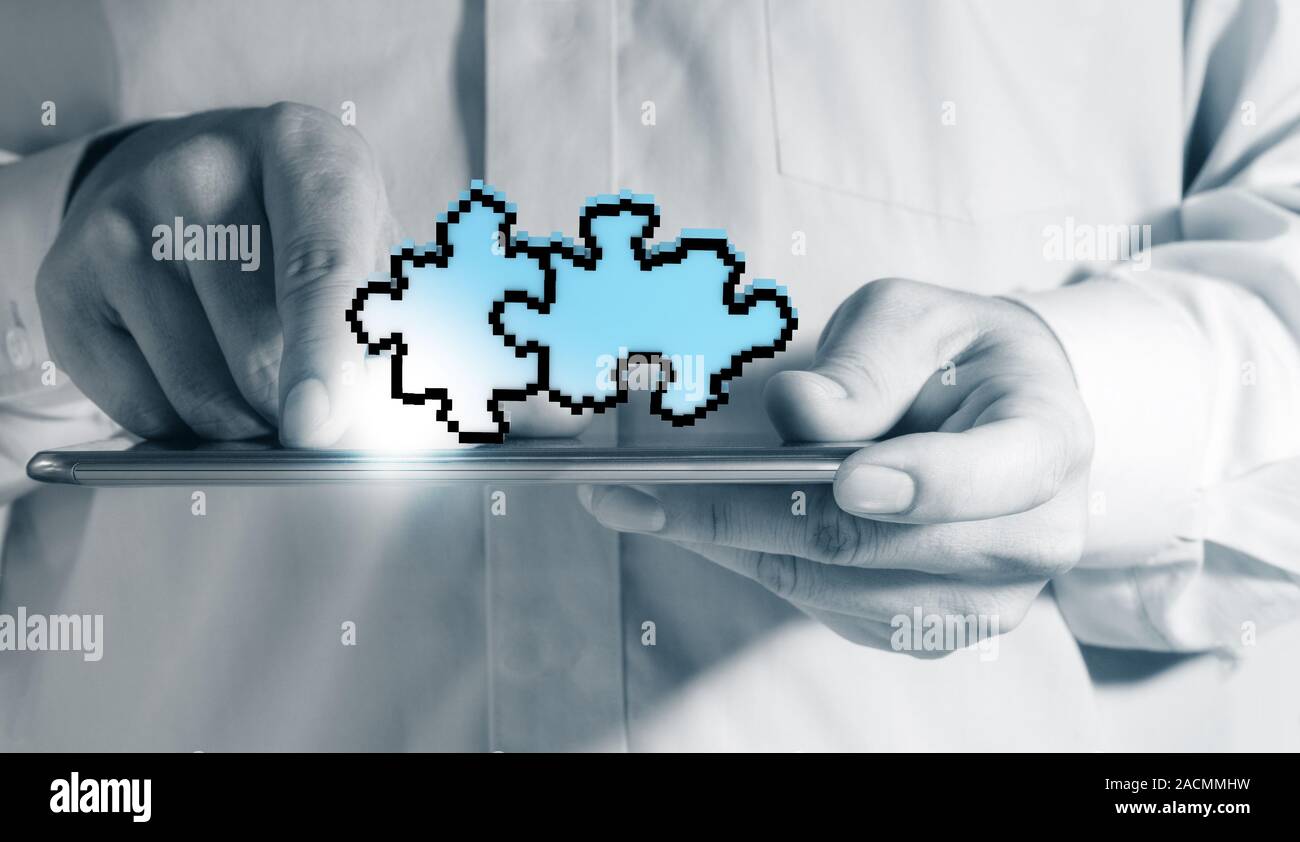 tablet computer and pixel puzzle Stock Photo - Alamy