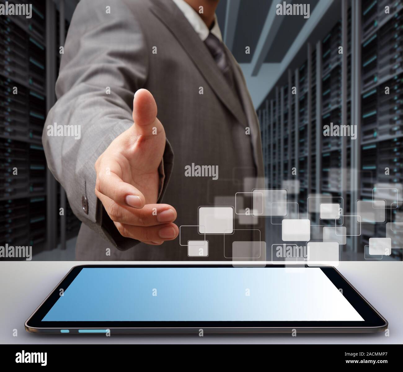 Business man offers hand shake in a technology data center Stock Photo ...