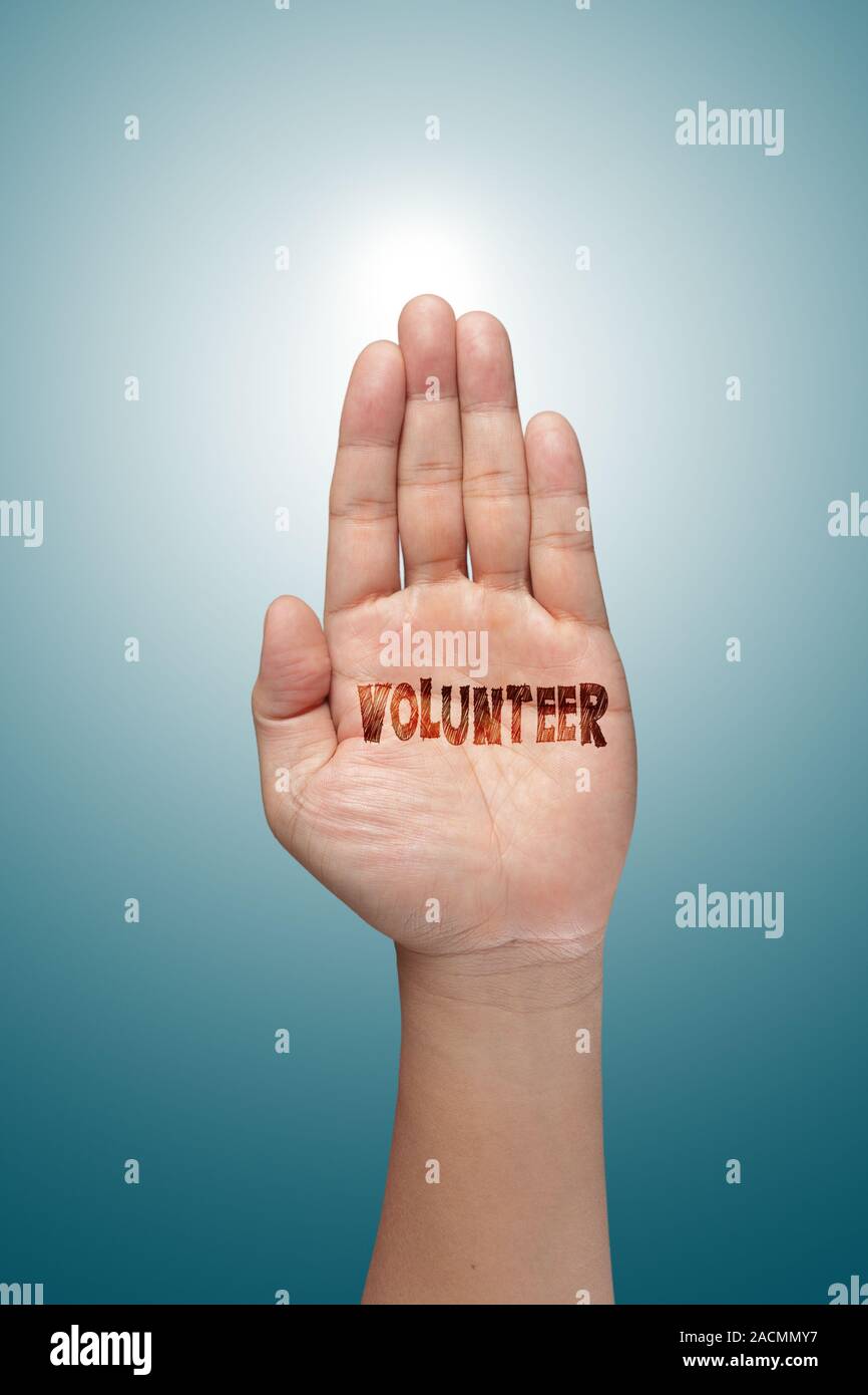 volunteer raising hand Stock Photo - Alamy