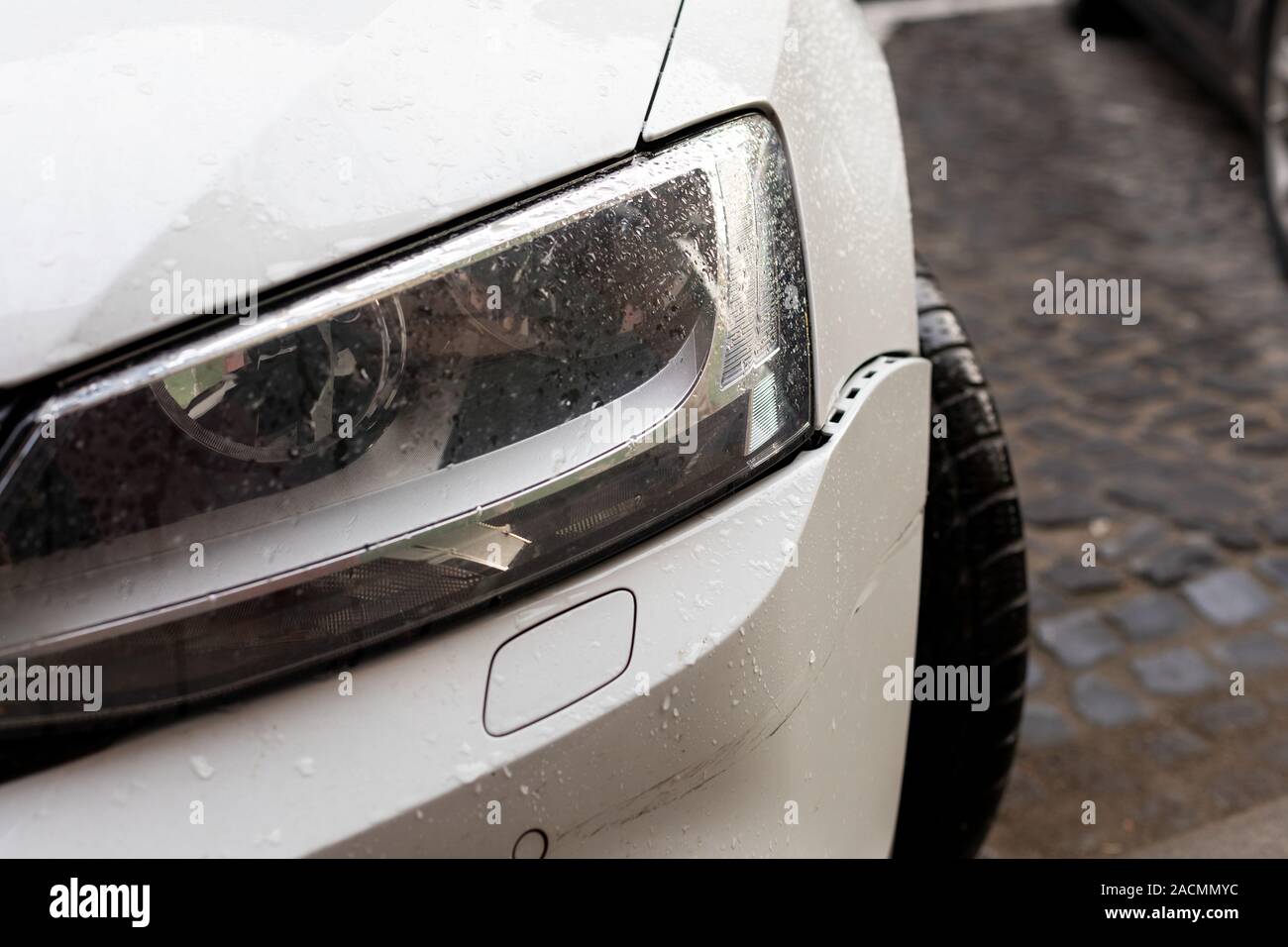 Scenic picture of a street in Sibiu medieval center, cars parked along ...
