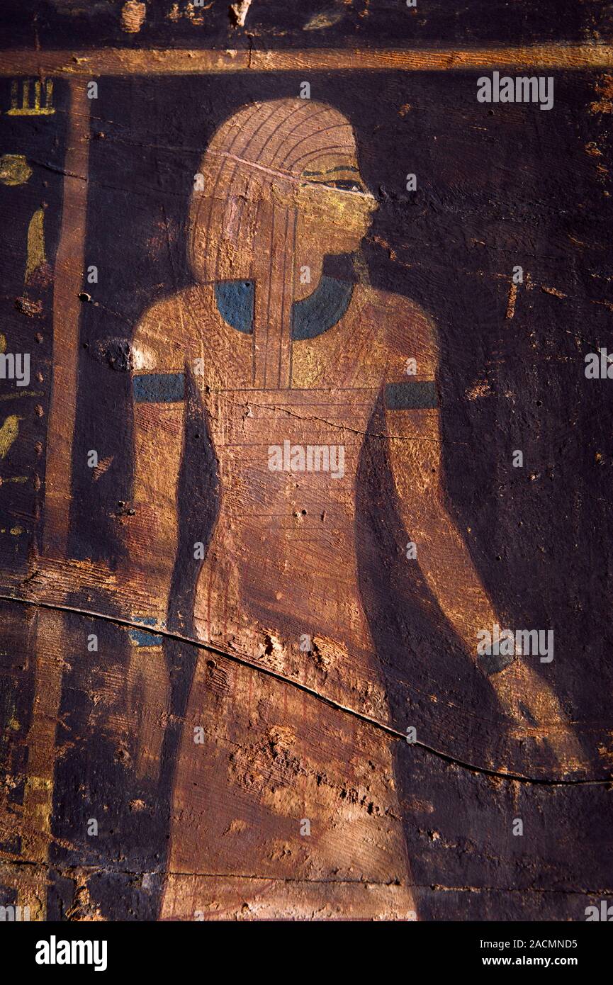 Egyptian coffin restoration. Close-up of the surface of a wooden coffin ...