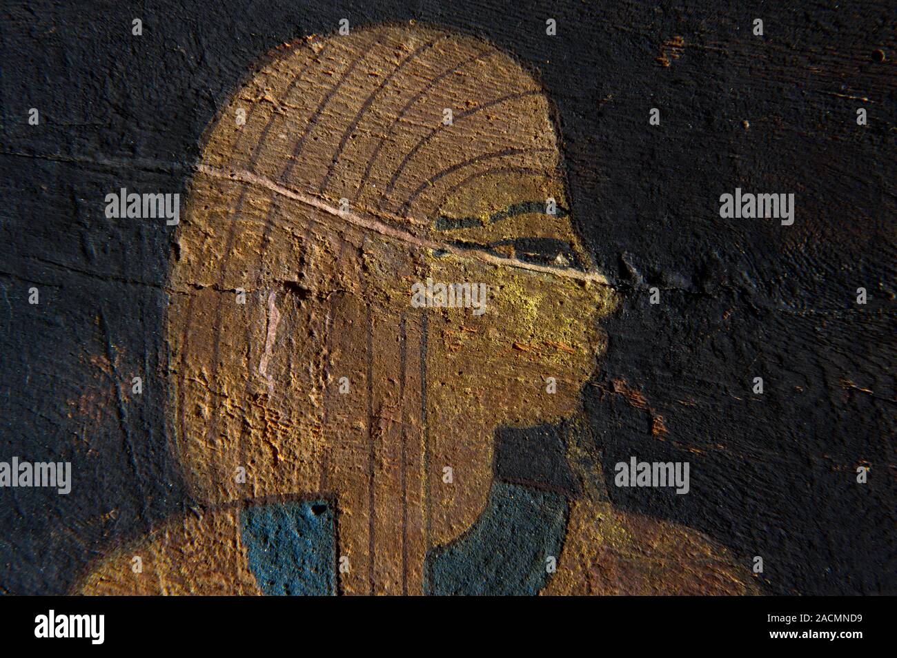 Egyptian coffin restoration. Close-up of the surface of a wooden coffin ...