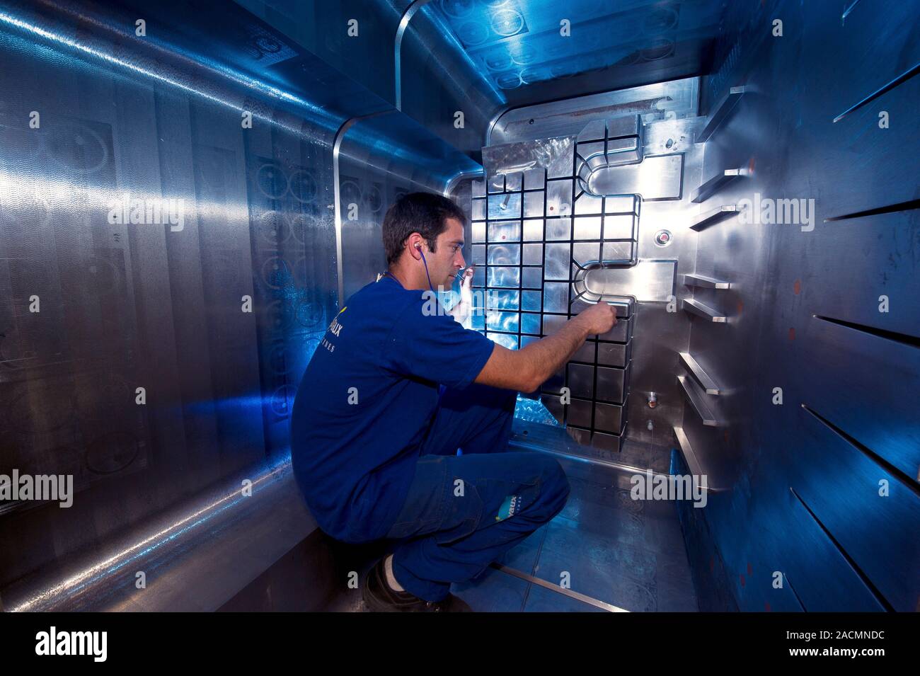 Swimming pool manufacturing. Worker at the Desjoyeaux swimming pool ...