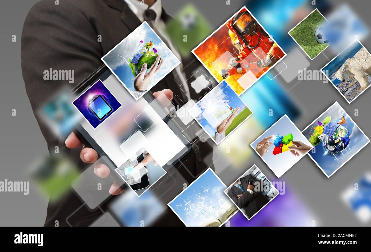 Business hand shows touch screen mobile phone with streaming images ...