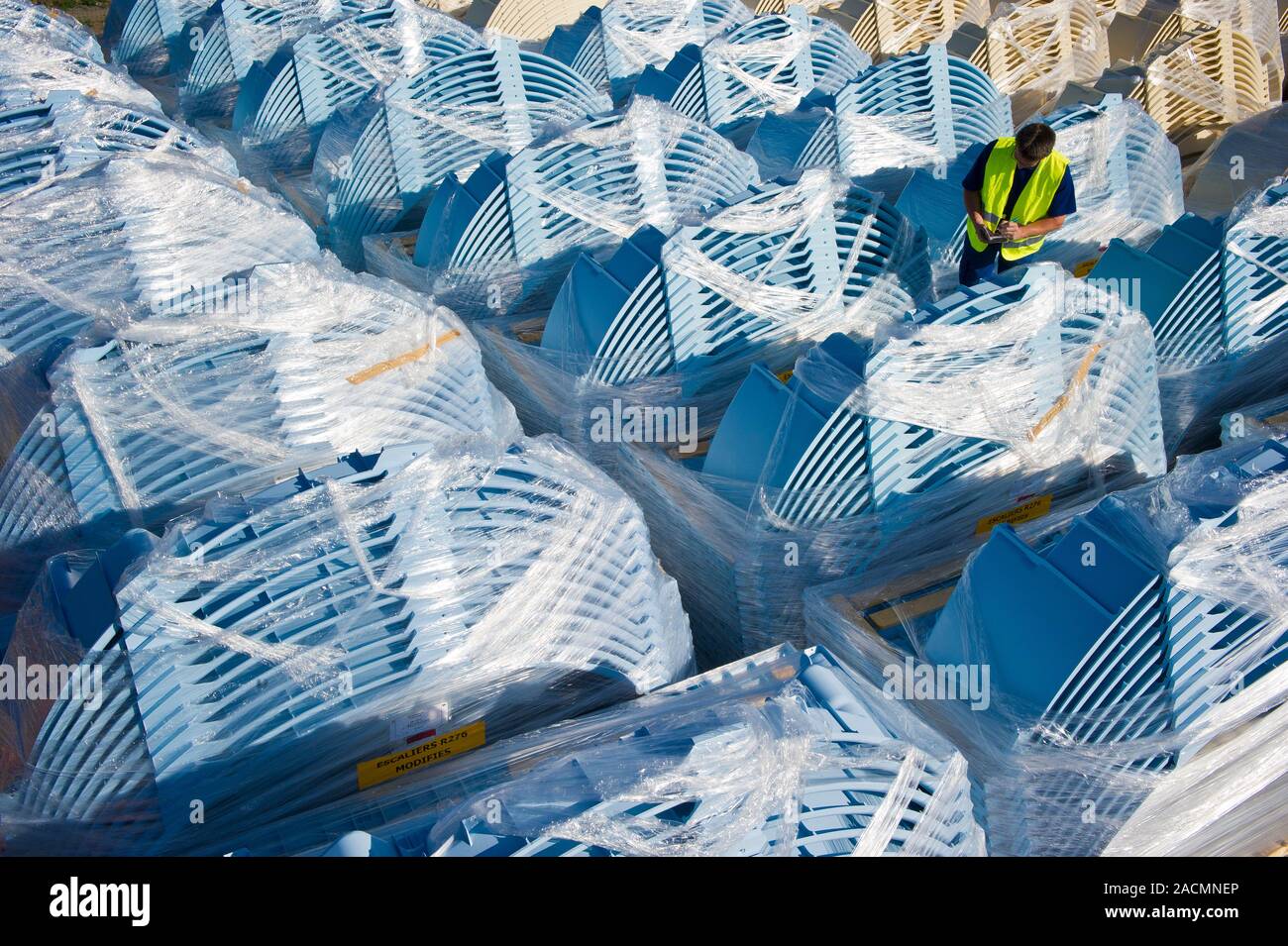 Swimming pool manufacturing. Worker at the Desjoyeaux swimming pool ...