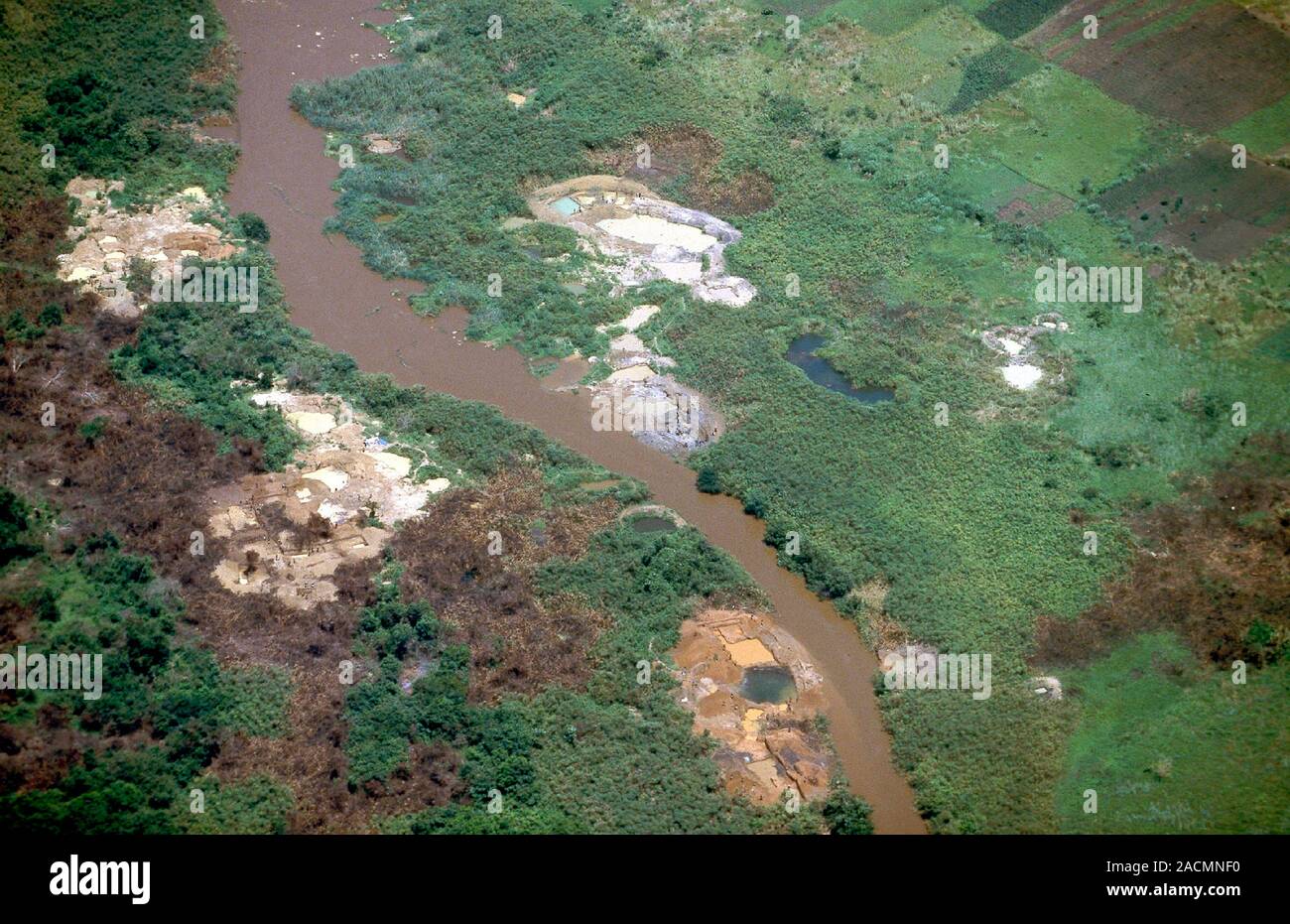 Coltan ore mining. Aerial photograph of mining pits where coltan ore is ...