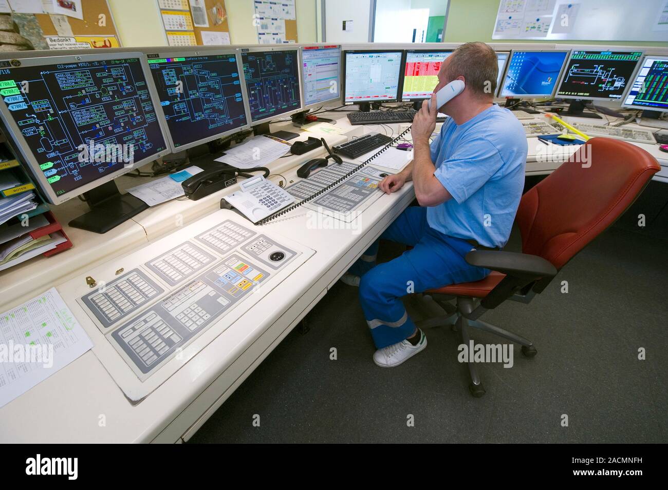 Chlorine production control room. Controller monitoring screens at a ...