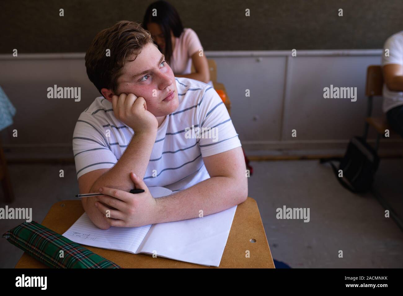 Teenagers in school classroom Stock Photo - Alamy