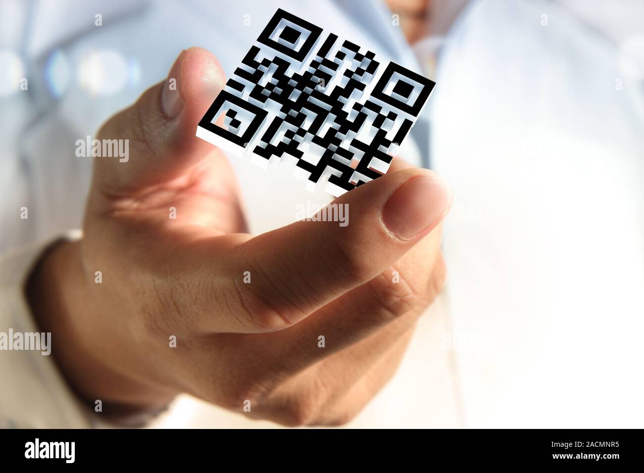 Business hand shows 3d Qr code Stock Photo - Alamy