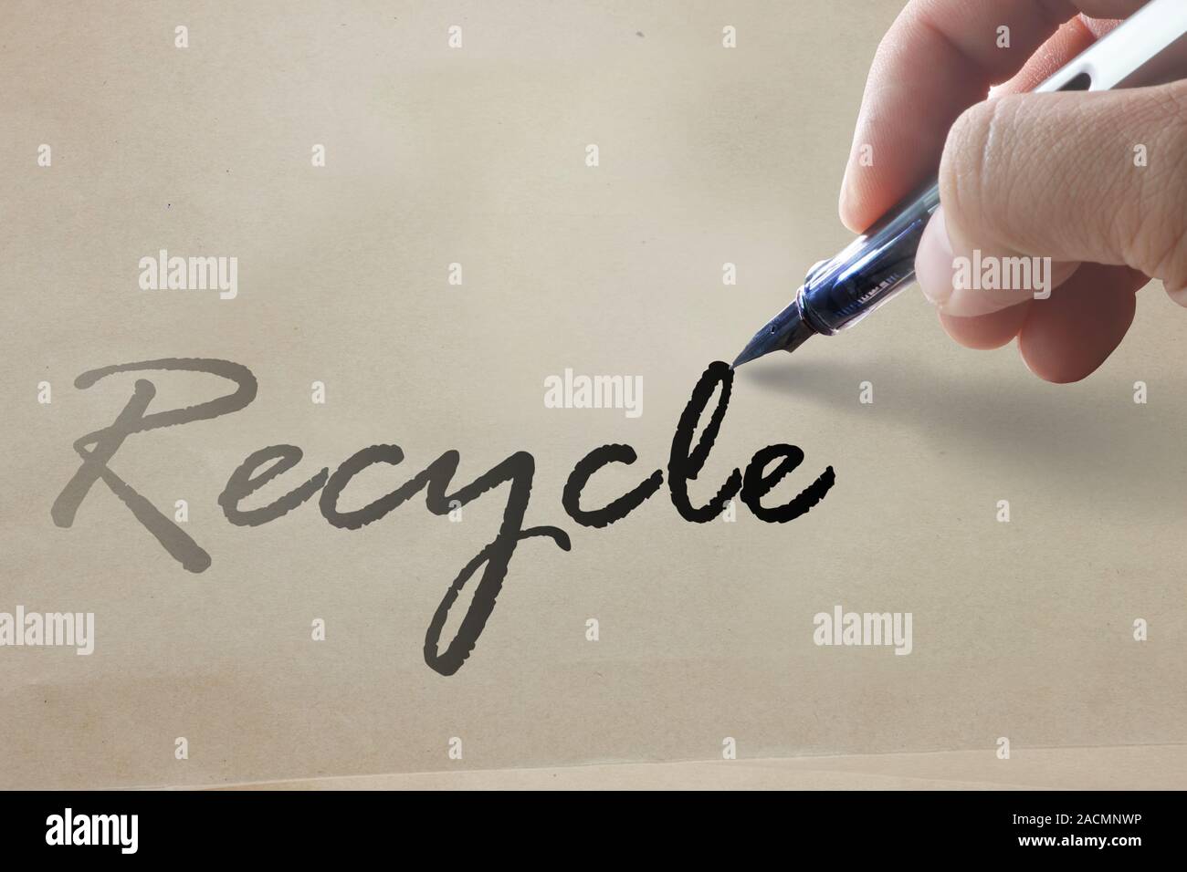 hand write recycle word on recycle paper Stock Photo - Alamy