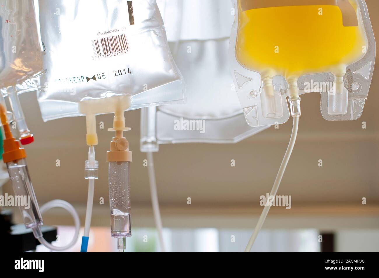 Intravenous drip equipment. Close-up of valves and tubing for ...