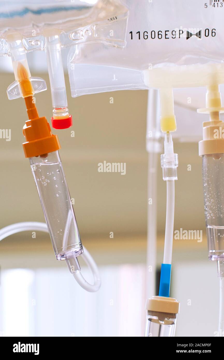 Intravenous drip equipment. Close-up of valves and tubing for ...