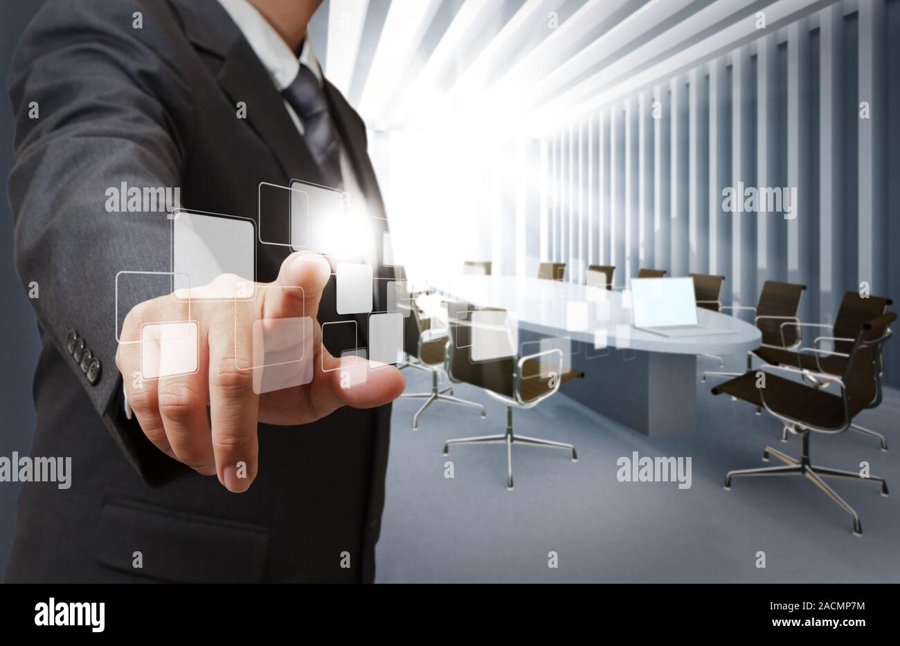 Business man point virtual buttons in board room Stock Photo - Alamy