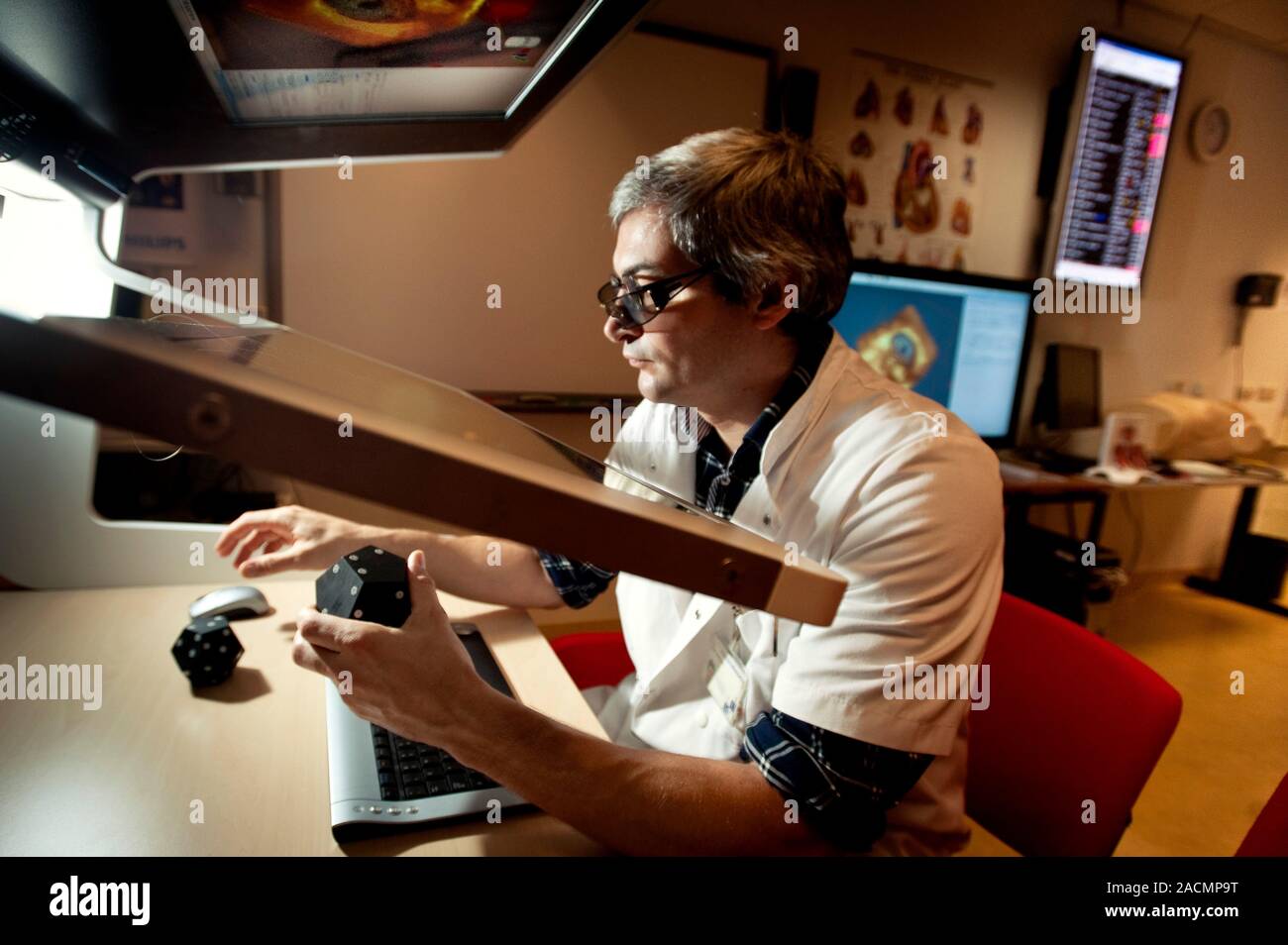 3D ultrasound cardiography. Cardiologist performing a 3D ultrasound ...