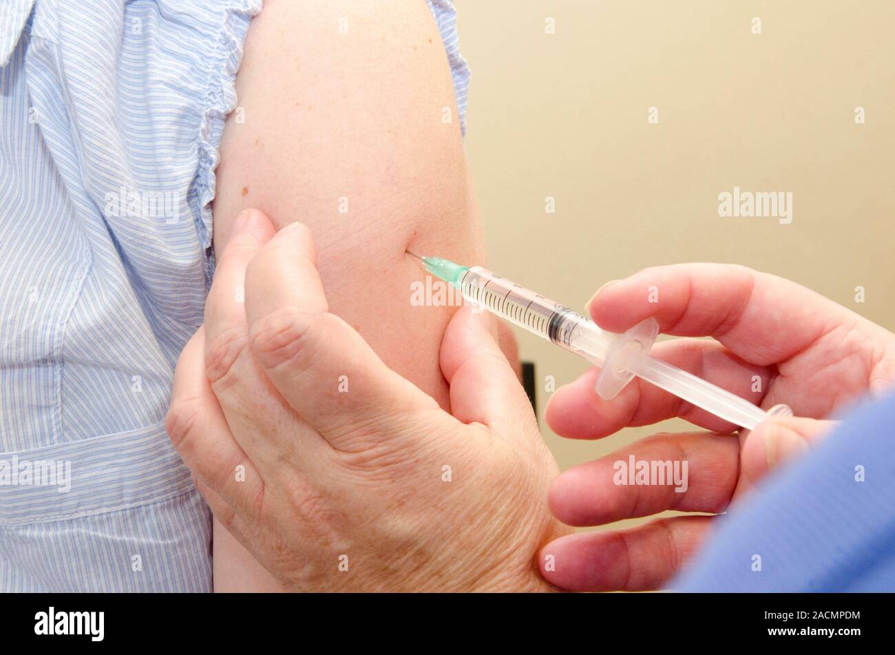 Anti-D injection into the upper arm of a 24 year old female patient ...
