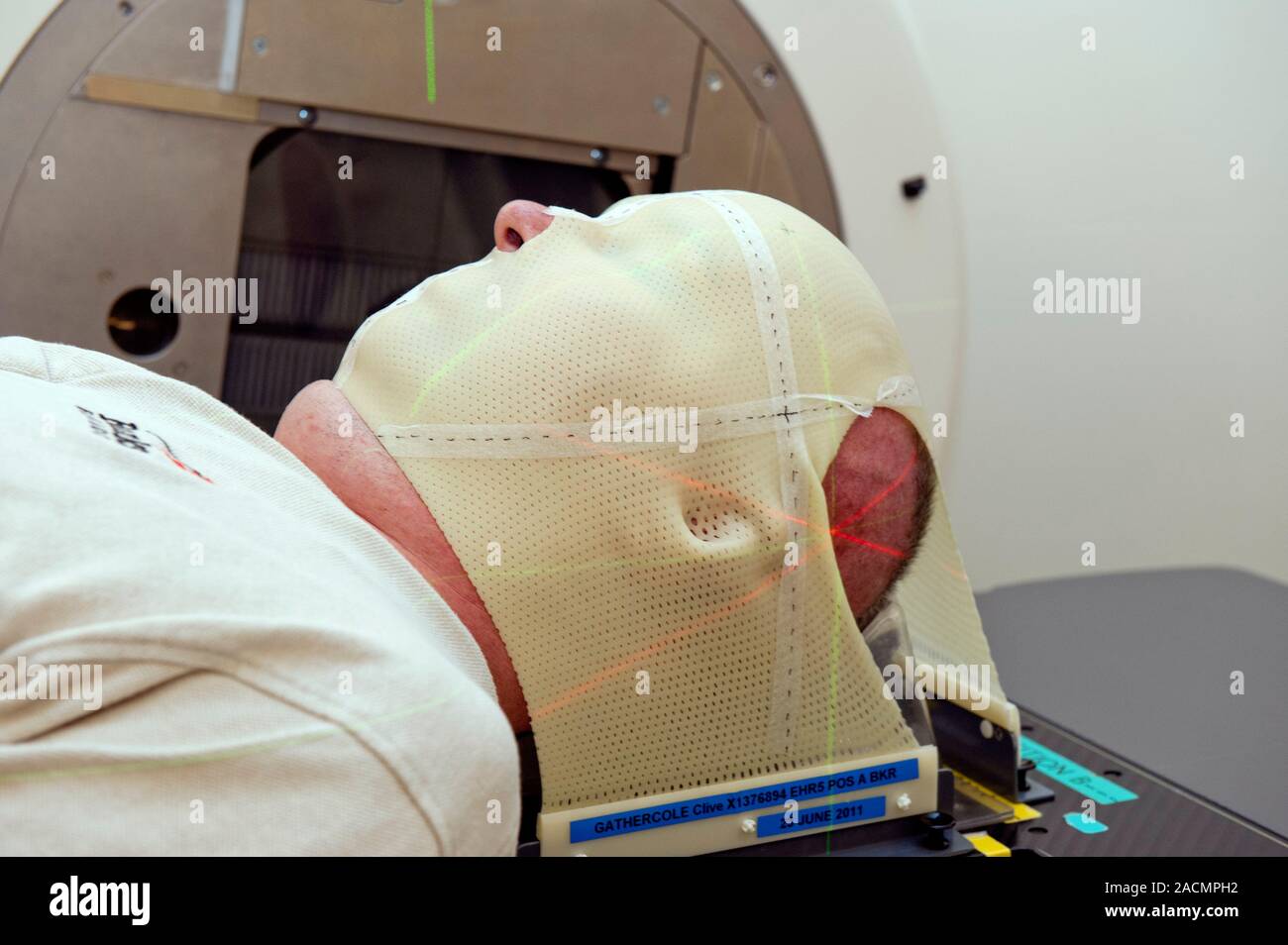 Male brain cancer (glioblastoma multiforme) patient wearing a mask is ...