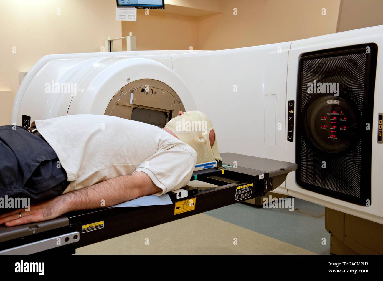 Male brain cancer (glioblastoma multiforme) patient wearing a mask is ...