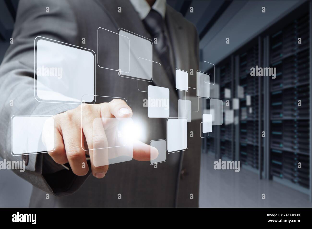 Businessman pushing virtual buttons and server room background Stock ...