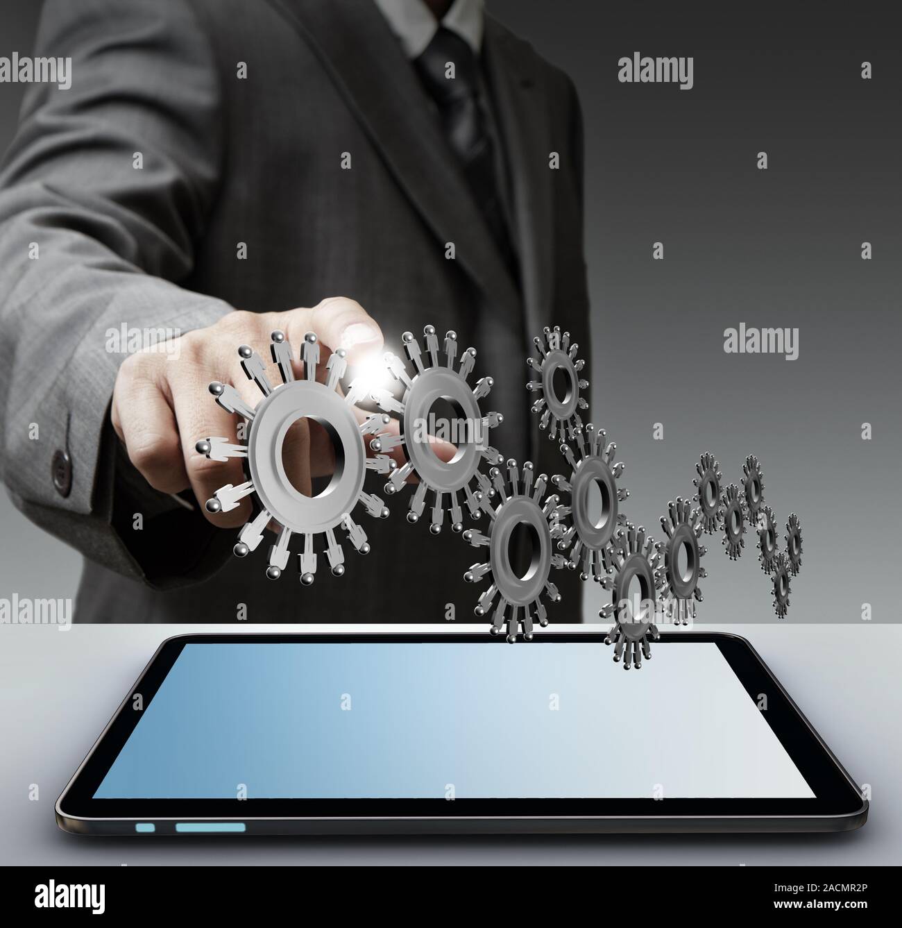 Business man show gear to success Stock Photo - Alamy