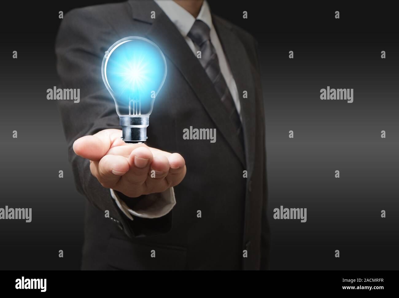 Light bulb in hand Stock Photo - Alamy