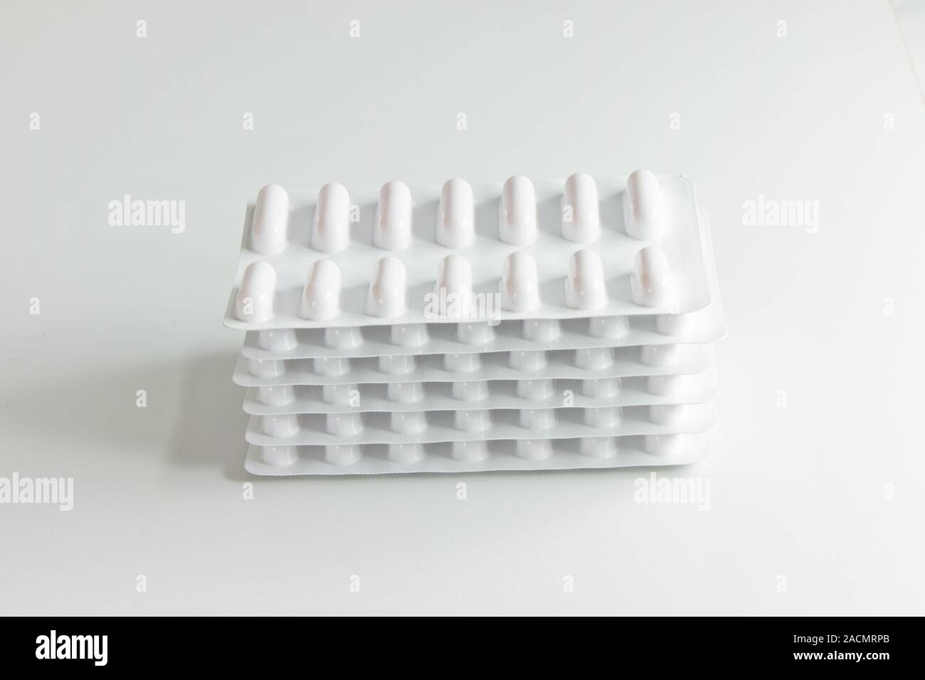 Blister stack packs of white pills Stock Photo - Alamy
