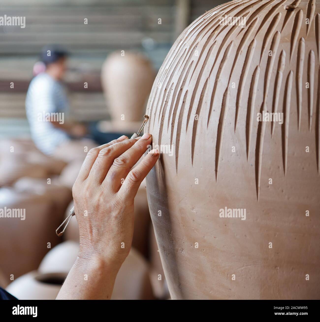 Skilled wet hands potter shaping hi-res stock photography and images ...