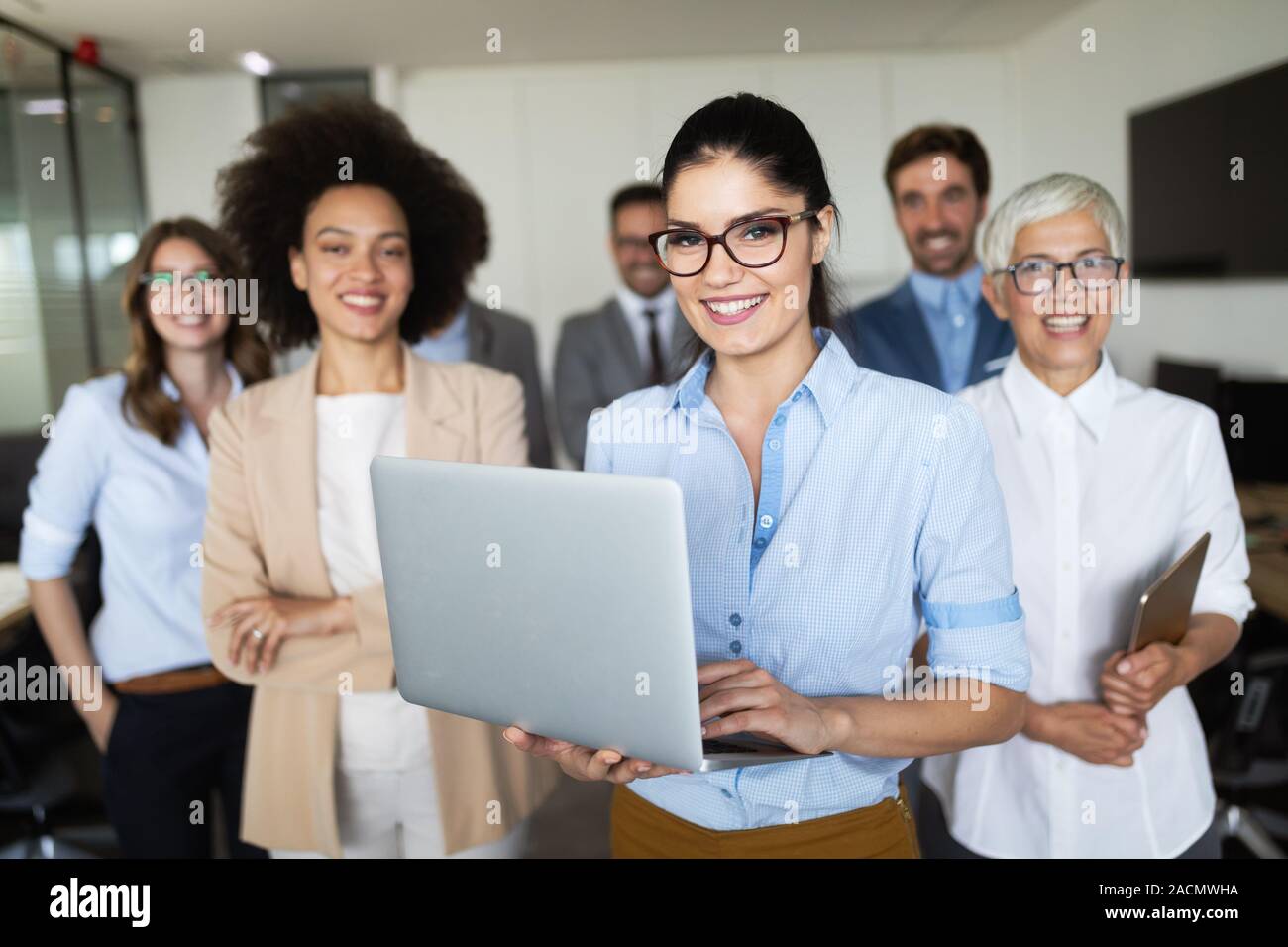 Group of successful business people at work in office Stock Photo - Alamy