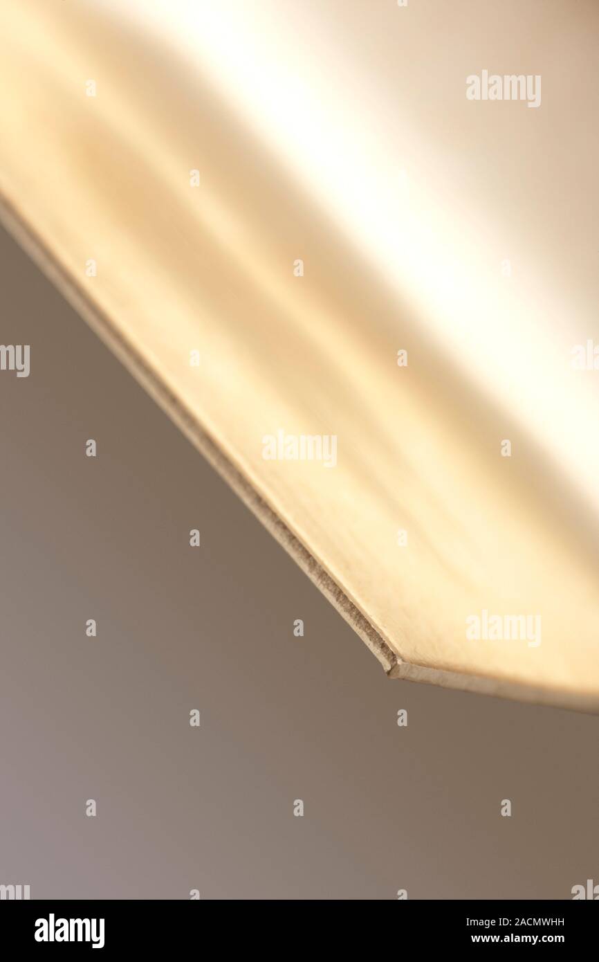 Gold sheet. Sample of gold in sheet form. Gold (Au) is a transition ...