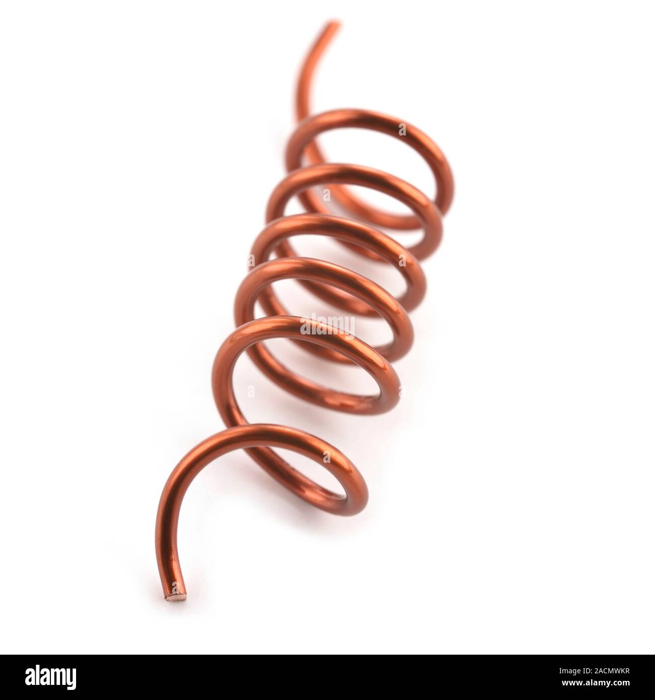 Copper wire coil. Copper (Cu) is a transition metal element. It is a ...