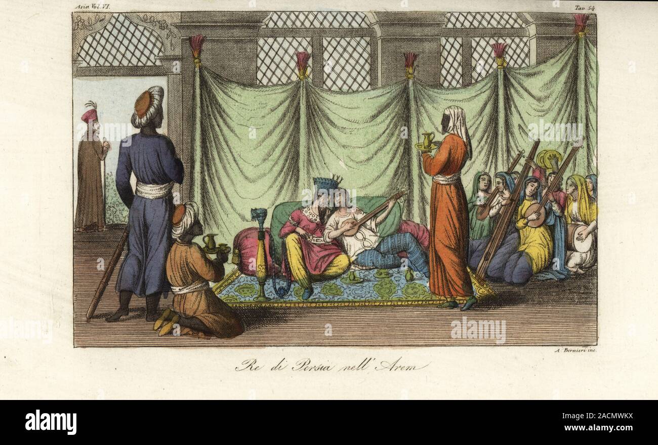 The Shah of Persia relaxing in his harem or seraglio. He sits on a ...