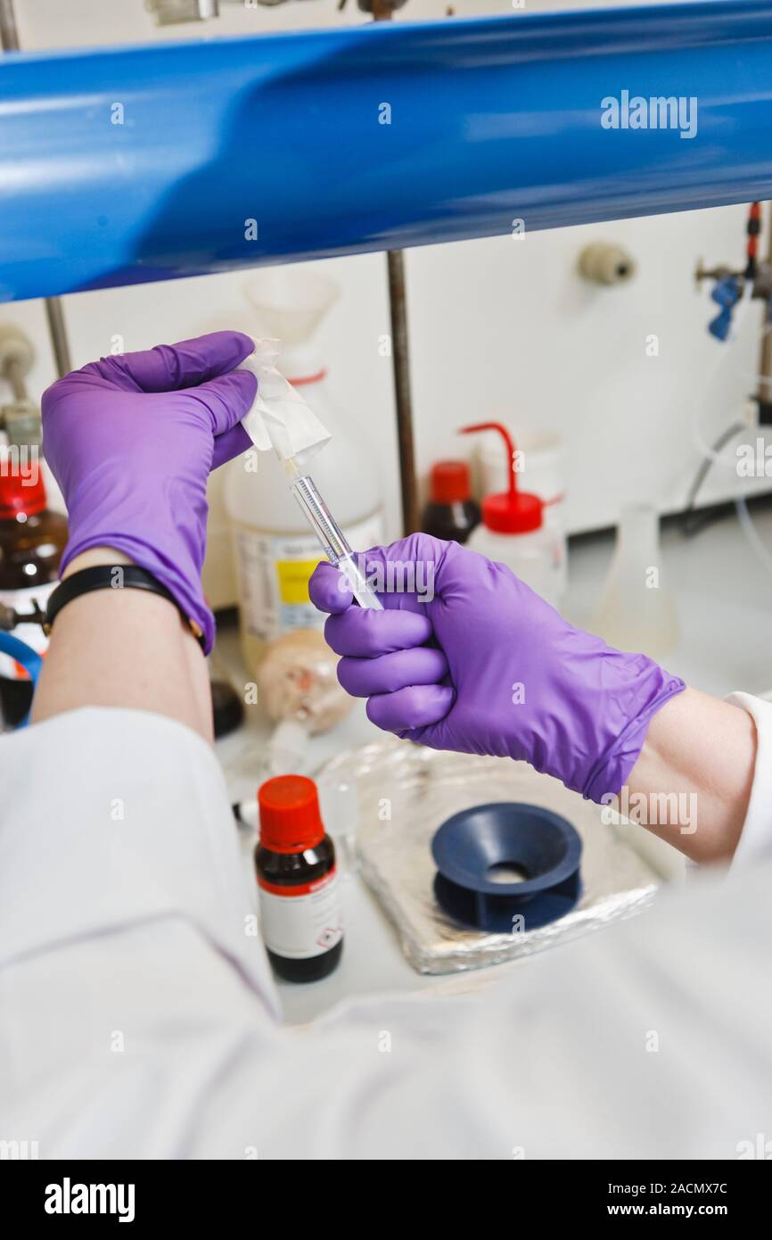 Protein kinase research. Researcher synthesising protein kinases as ...