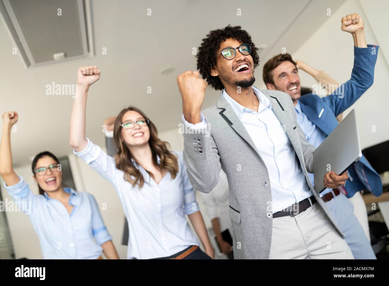 Business team celebrating a good job in the office Stock Photo - Alamy