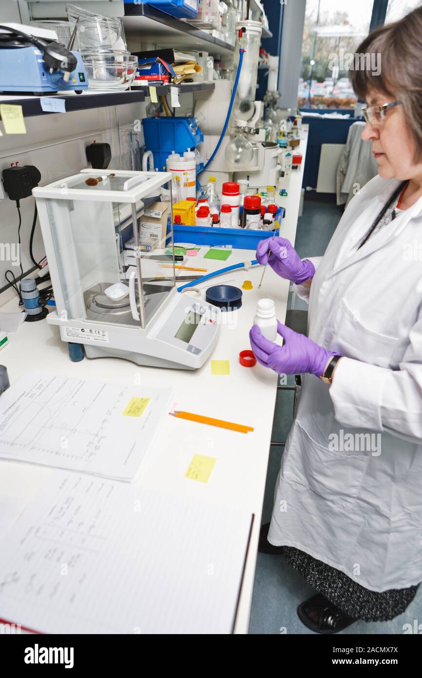 Protein kinase research. Researcher synthesising protein kinases as ...