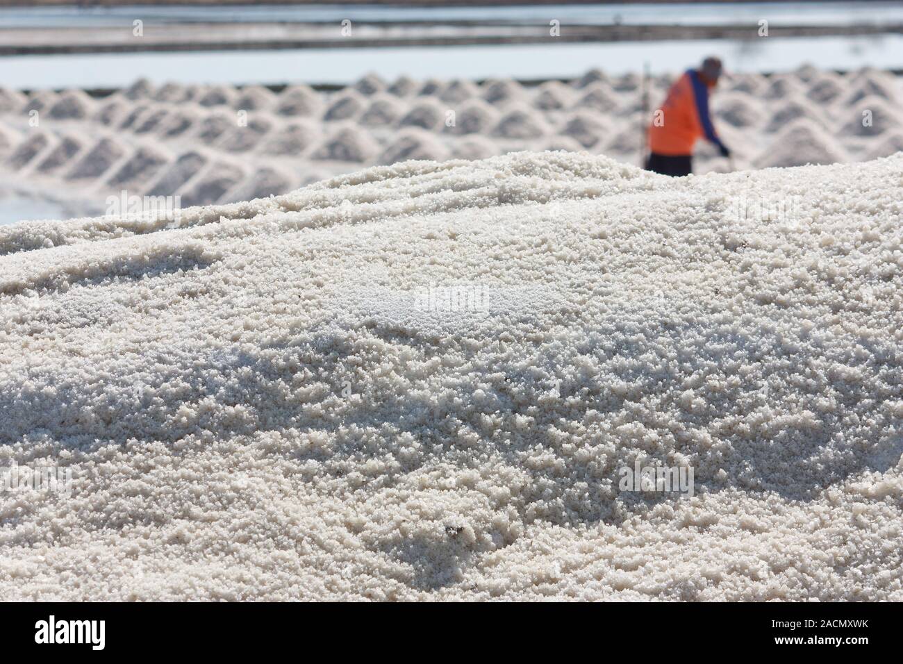 Salt texture with farmer Stock Photo - Alamy