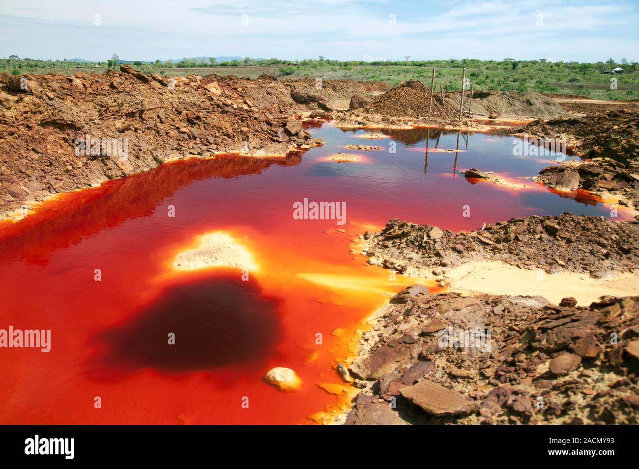 Acid mine drainage. Large pool of red coloured water caused by acid ...