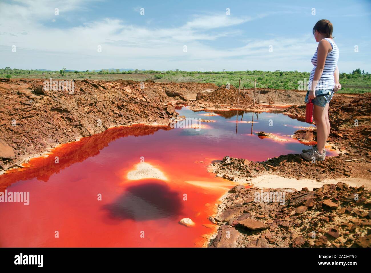 Acid mine drainage. Large pool of red coloured water caused by acid ...