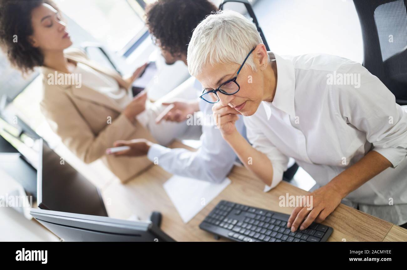 Programmer working in a software developing company office Stock Photo ...