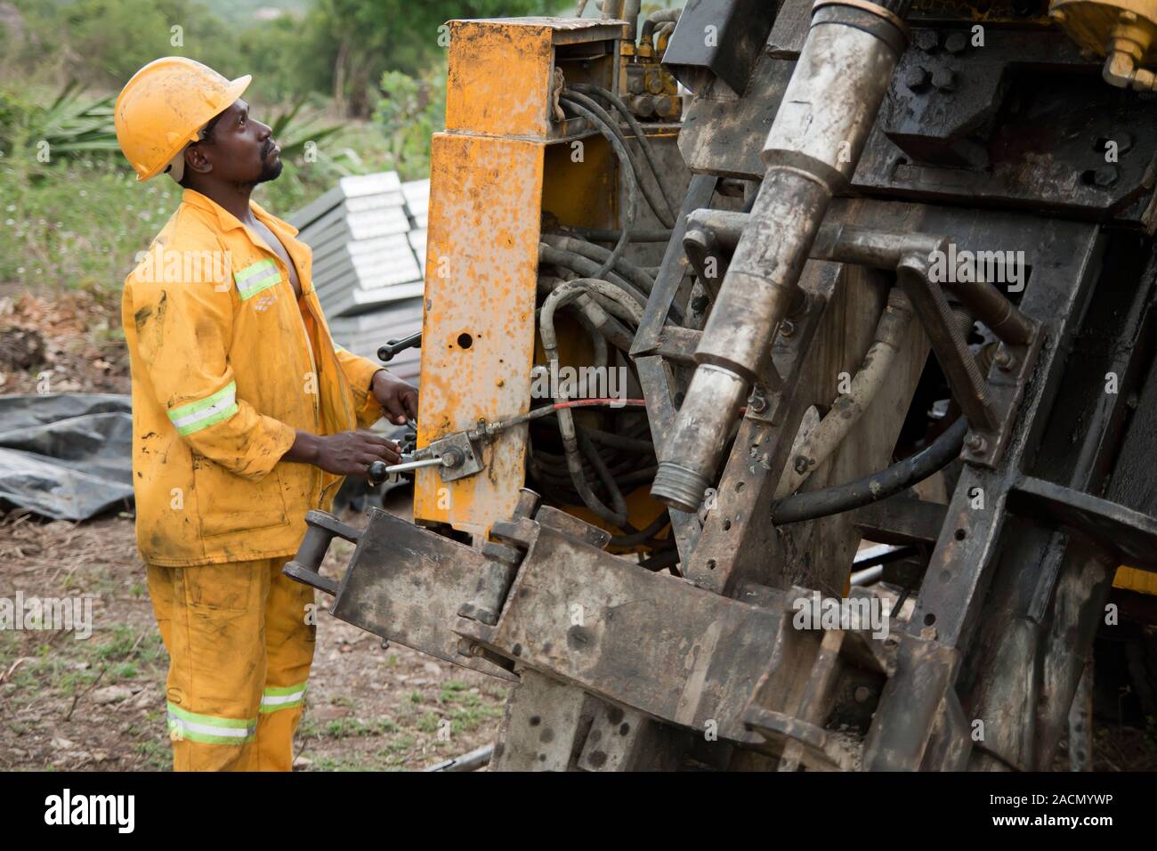 Mineral exploration drilling. Driller preparing a multi-combination ...
