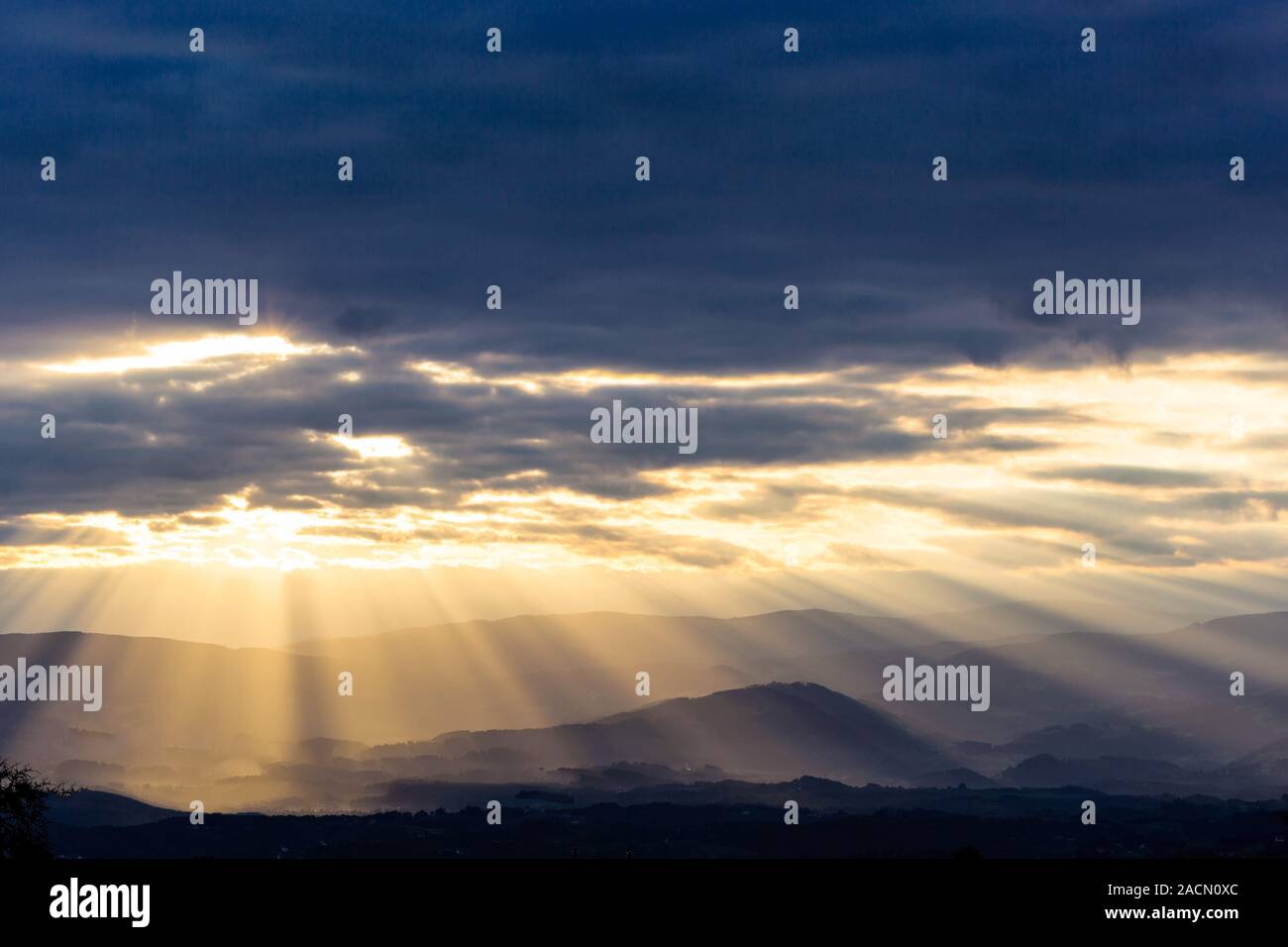 Light rays in the evening sky Stock Photo - Alamy