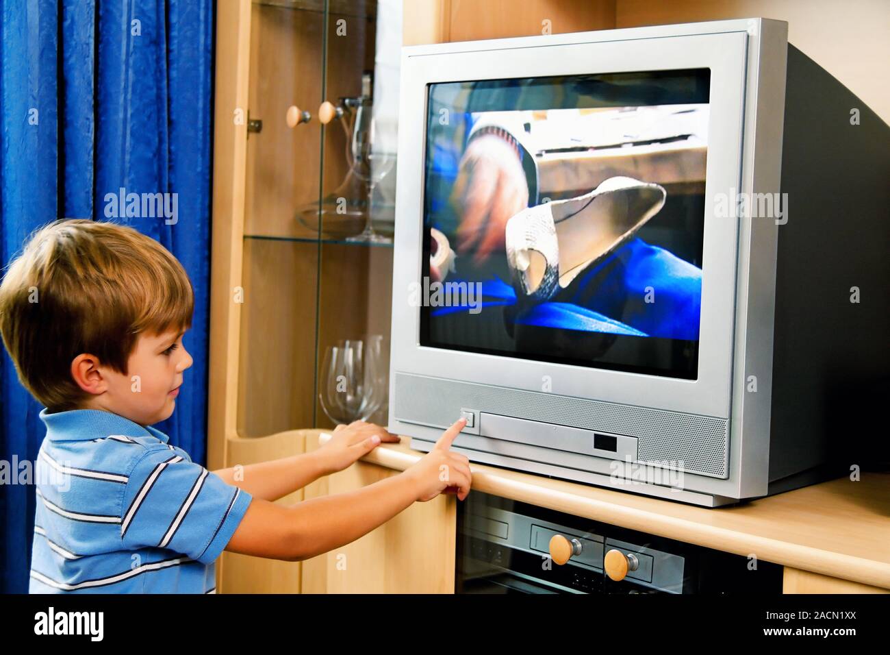 Small child watching television Stock Photo - Alamy