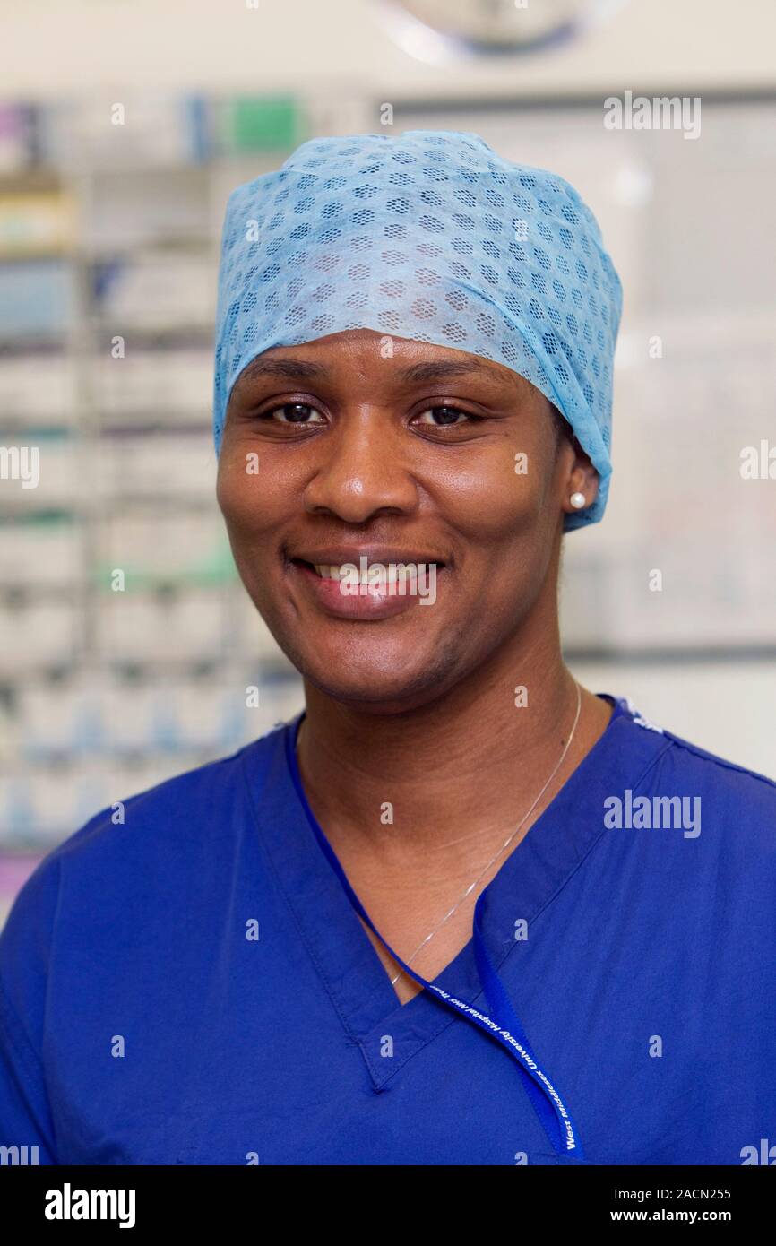 Surgical nurse smiling Stock Photo - Alamy