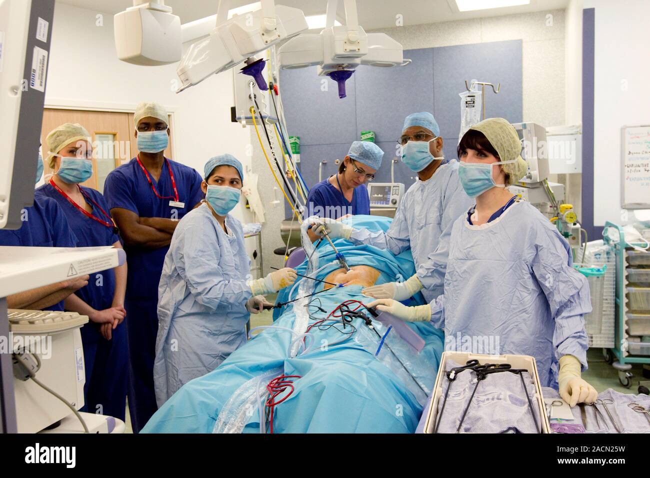 Hernia surgery. Surgeons performing a laparascopic (keyhole) repair of ...