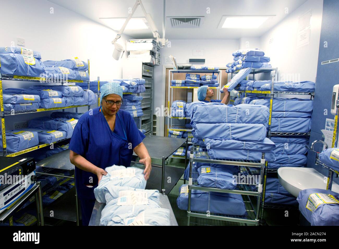 Surgical equipment room. Hospital staff sorting surgical instruments in ...