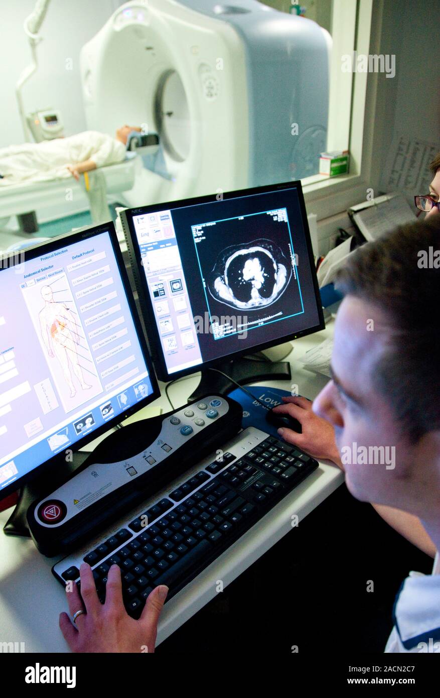 CT scanning. Woman patient under- goes a CT (Computed Tomography or CAT ...